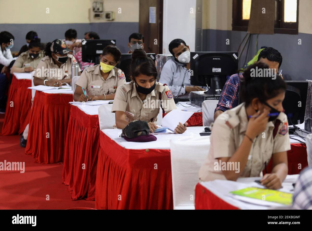 Indian volunteers from Delhi Civil Defence (DCD) wearing face masks ...