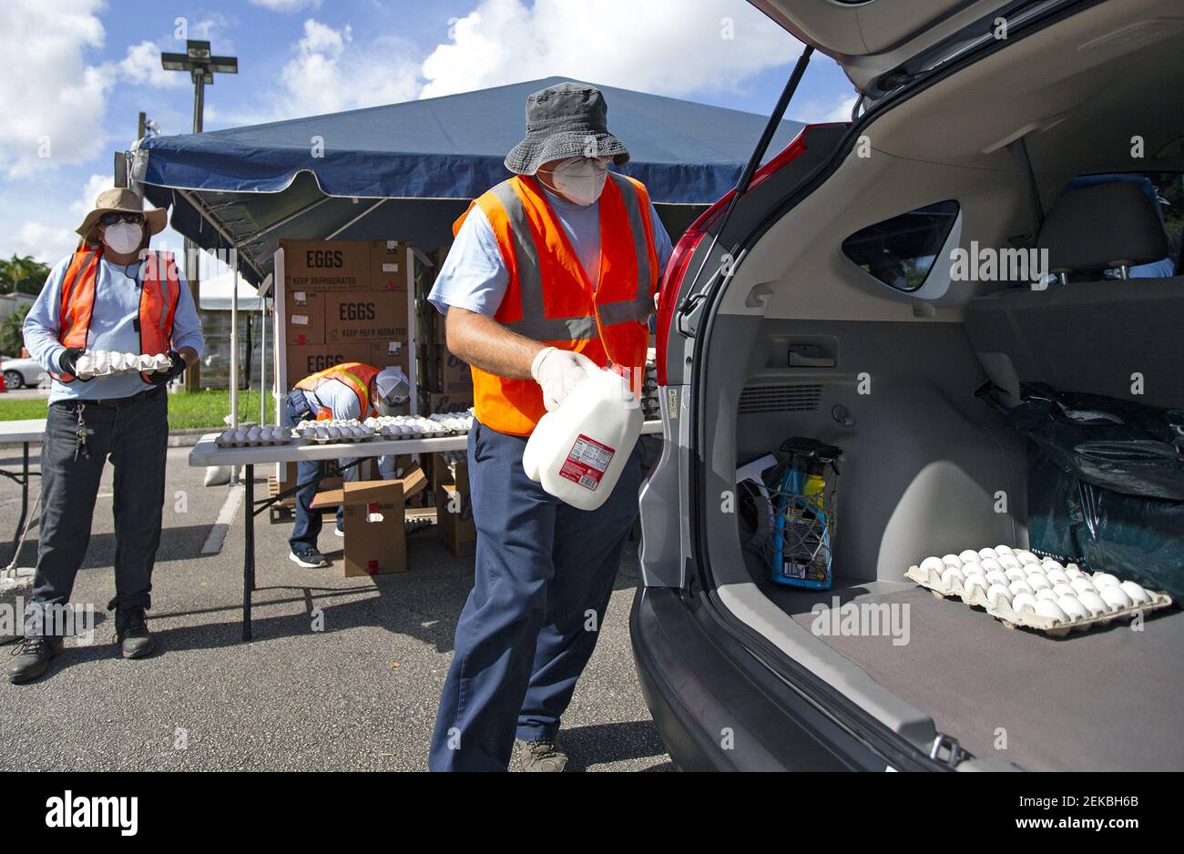 City of Hialeah employees load up milke and eggs to hundreds of ...
