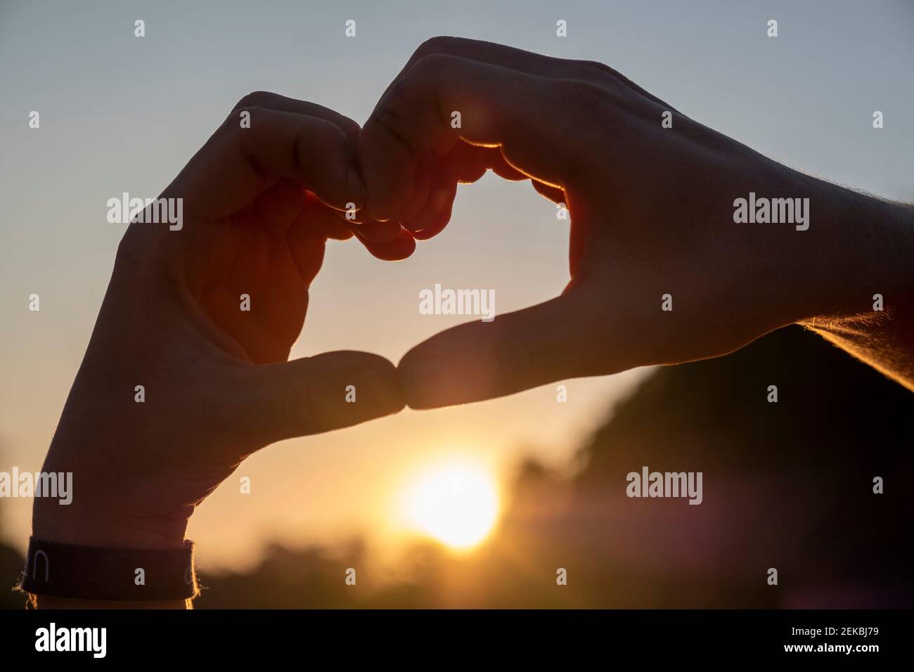 Man making heart hands hi-res stock photography and images - Alamy
