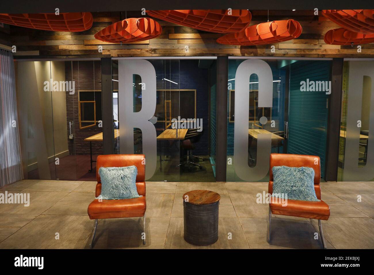 Tutoring pods are shown behind giant letter on glass at The House in ...