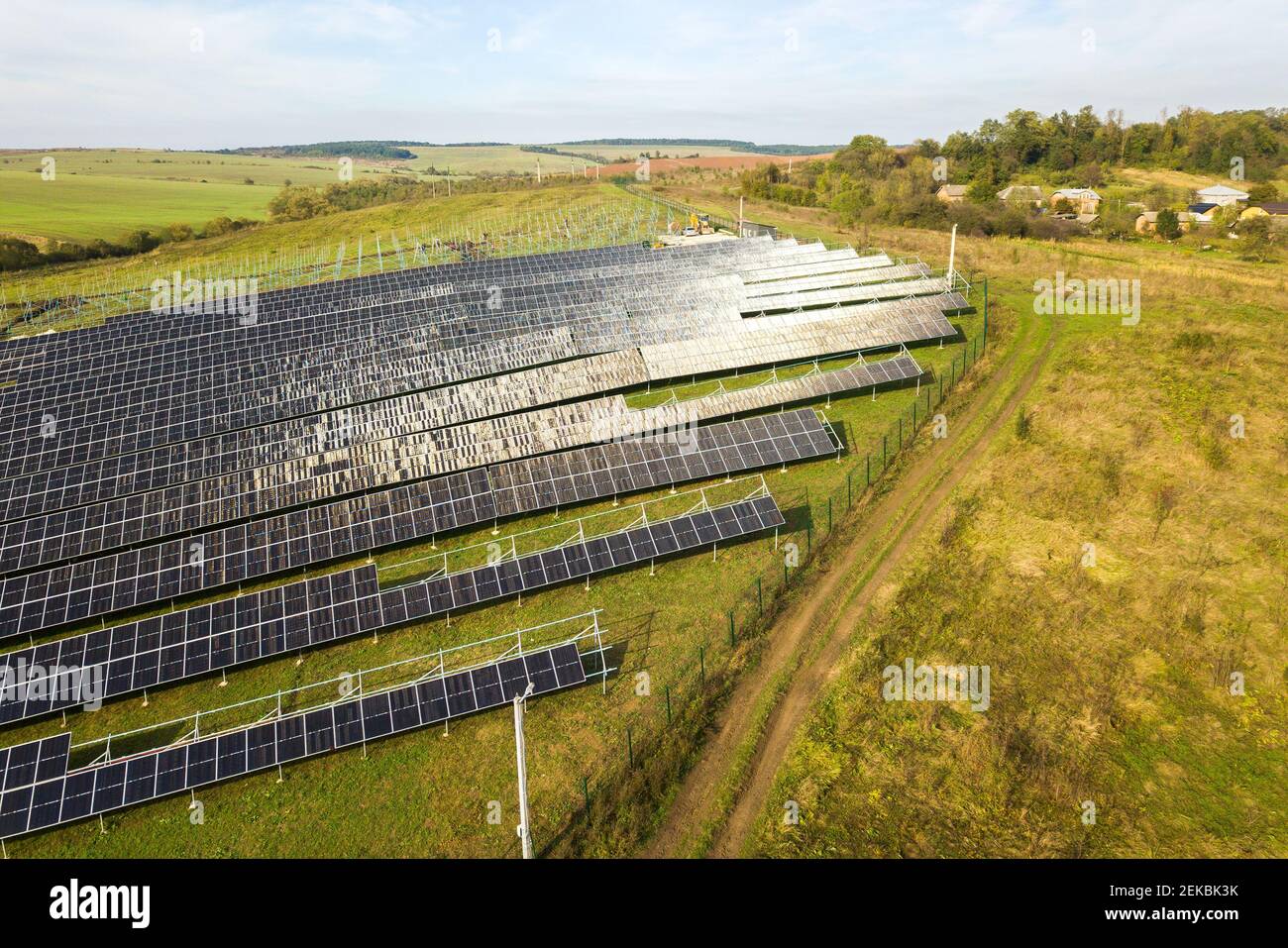 Aerial view of solar power plant under construction on green field ...