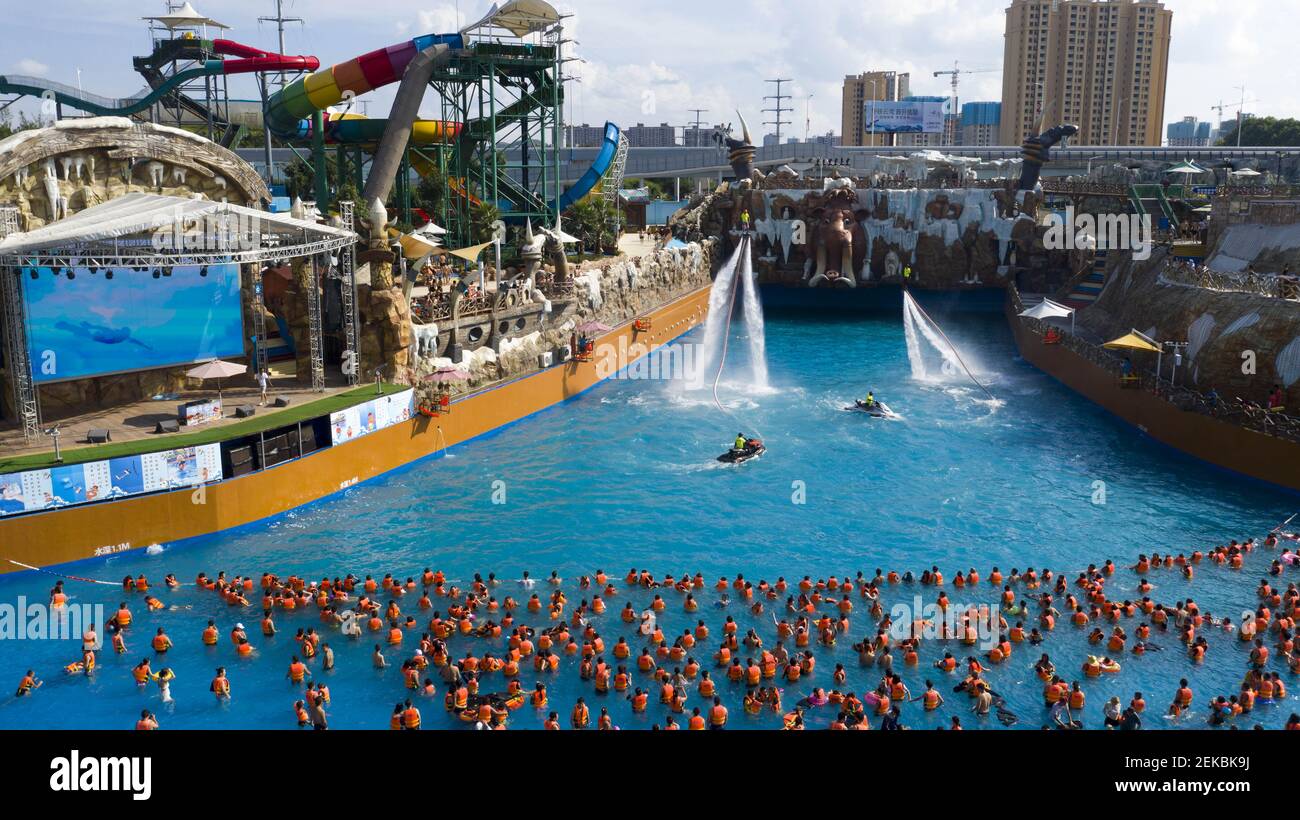 GUIYANG, CHINA - JULY 30, 2020 - Tourists play in a water park to ...