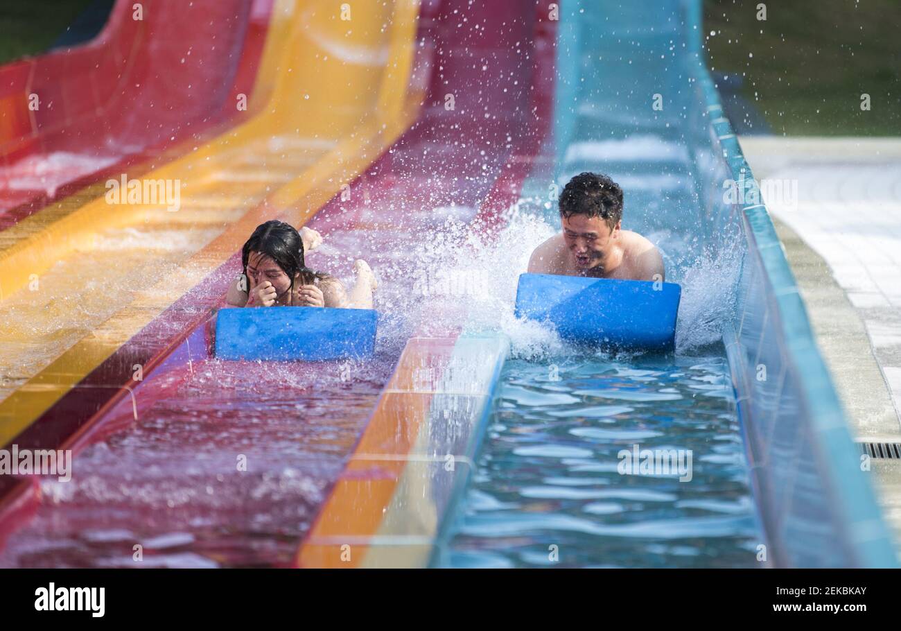 GUIYANG, CHINA - JULY 30, 2020 - Tourists play in a water park to ...