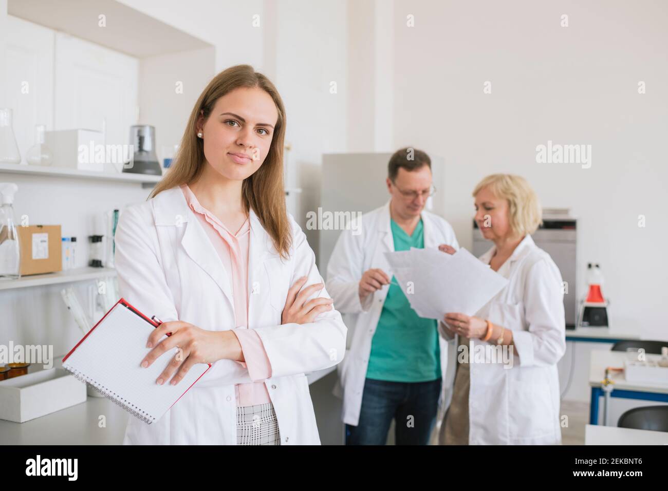 Portrait of young researcher in white coat in a lab Stock Photo - Alamy