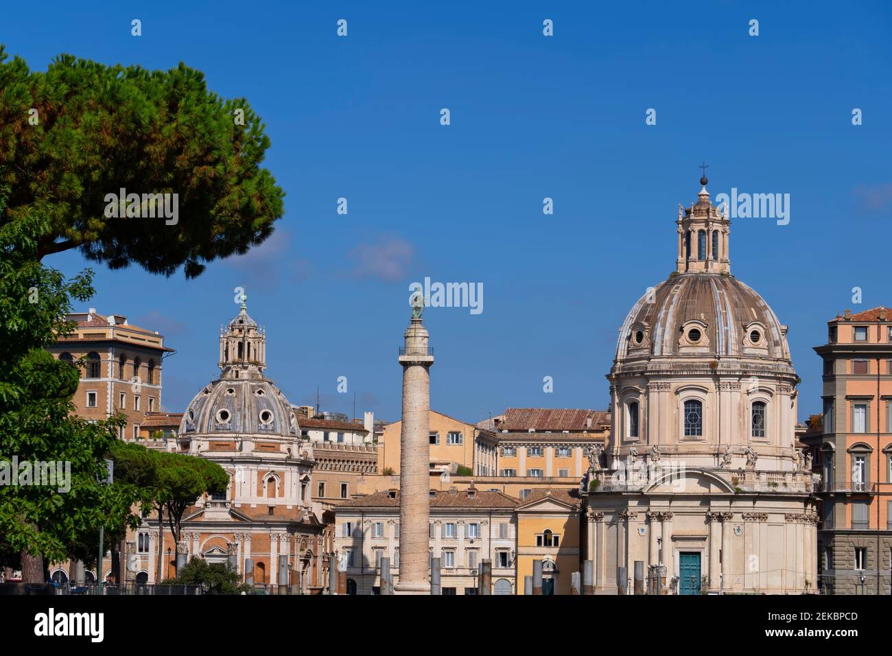 Italy, Rome, city skyline with domed churches and Trajan Column Stock ...