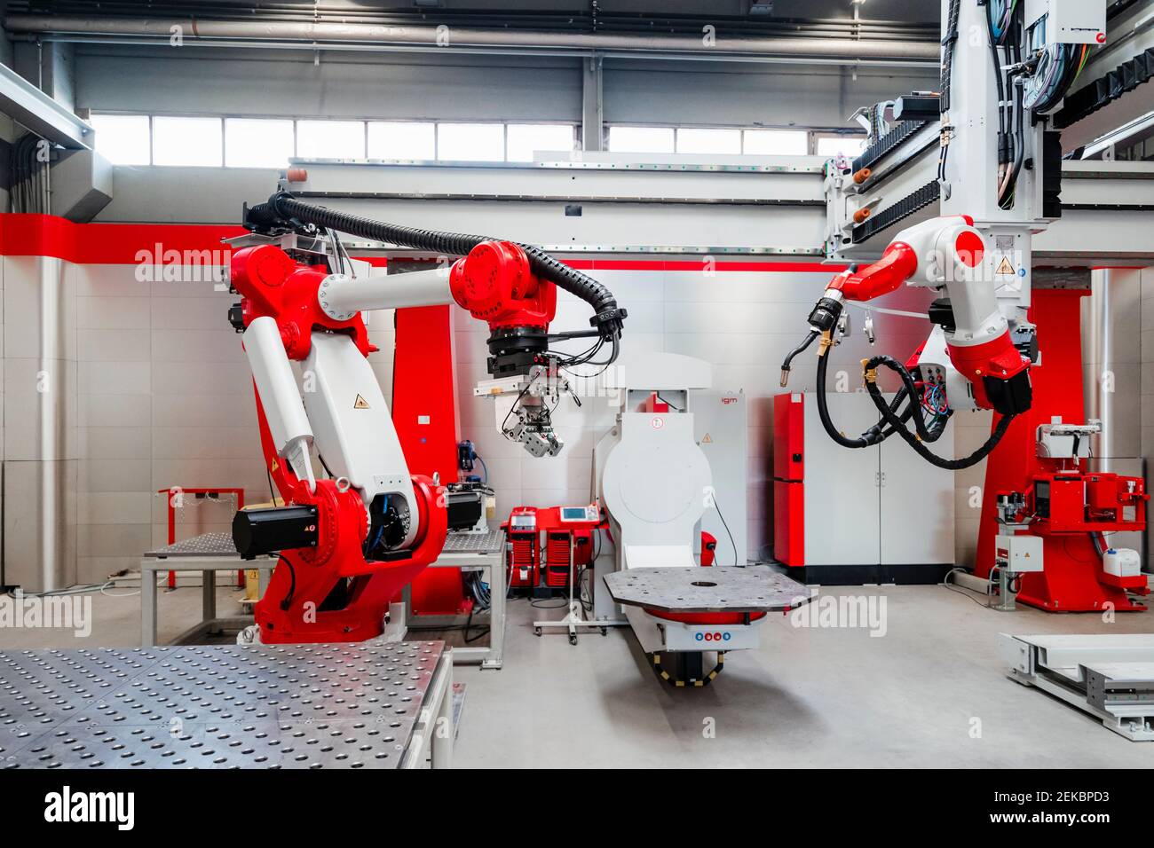 Automatic welding robots in industrial building Stock Photo - Alamy