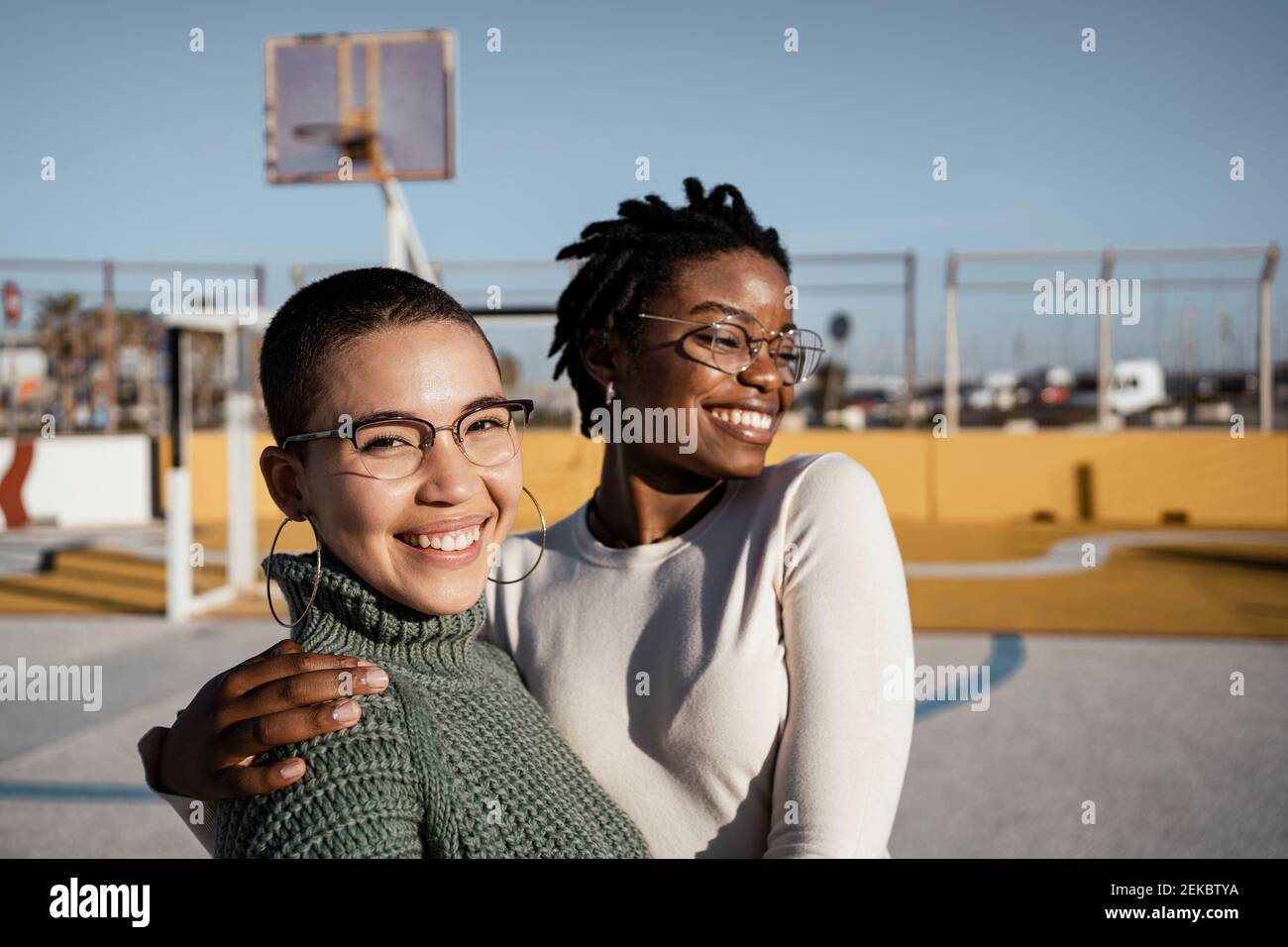 Two smiling women standing on hi-res stock photography and images - Alamy