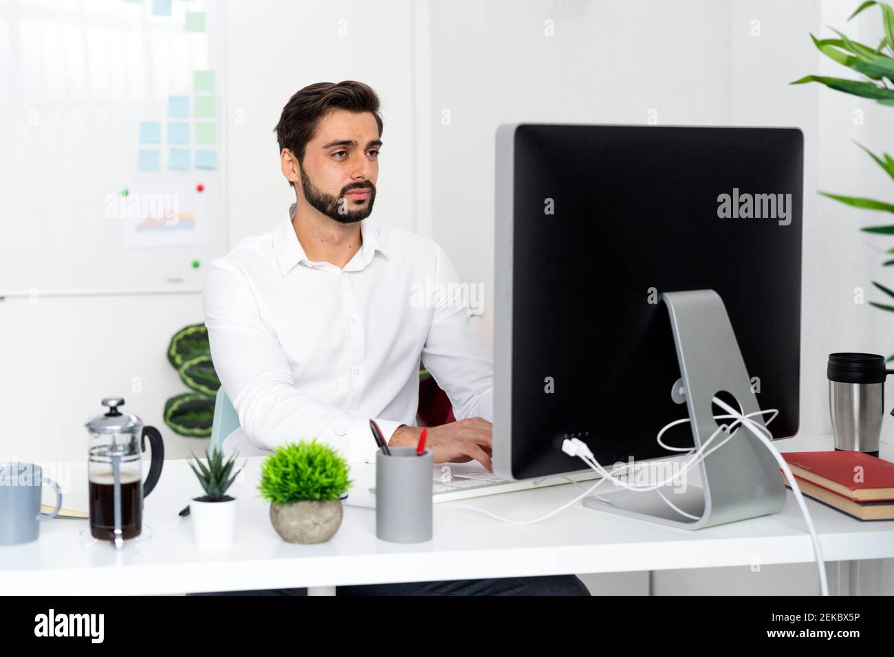 Working on computer at work hi-res stock photography and images - Alamy