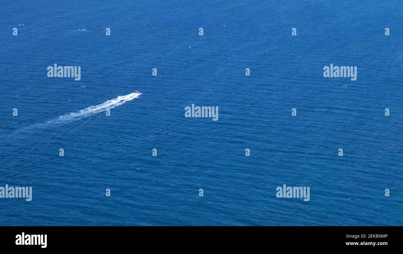 Small boat moves on beautiful hi-res stock photography and images - Alamy