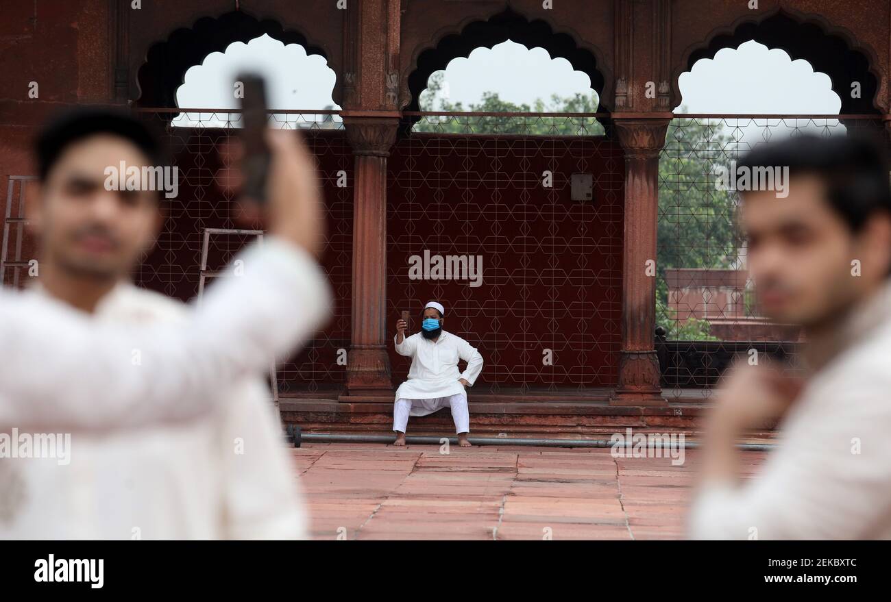 A Muslims man wearing a face mask as a preventive measure takes a ...