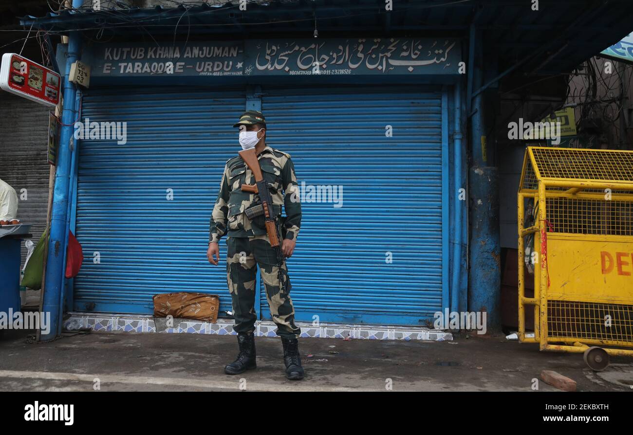 A border security officer wearing a face mask as a preventive measure ...