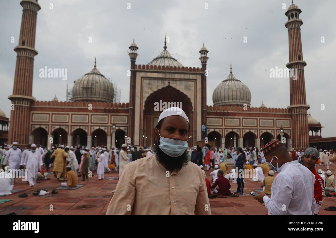 A Muslim man wearing a face mask as a preventive measure leaves after ...