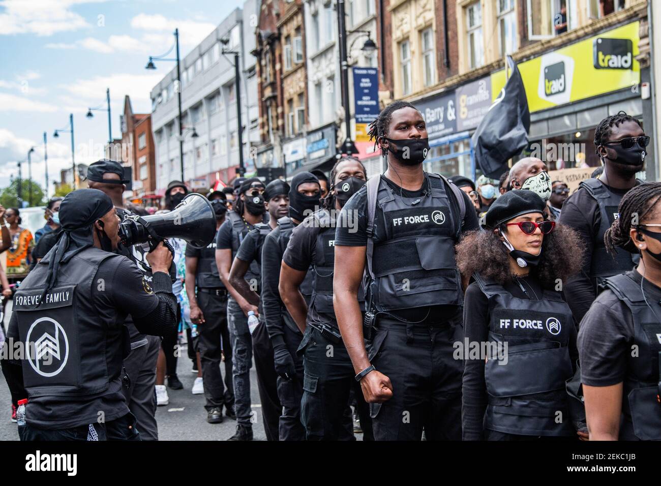 Members of FF Force AKA Forever Family stand outside Brixton town hall ...