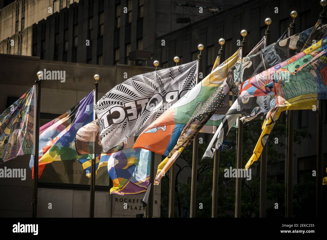 The flag designed by Jenny Holzer, center, joins the 193 flags ...