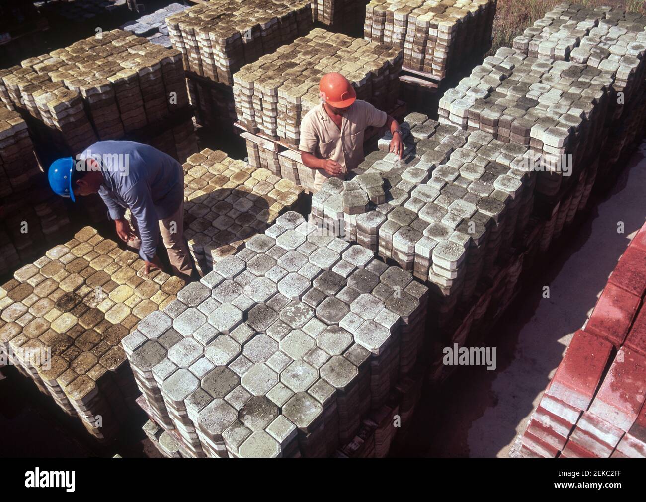 Workers stacking pavers in factory, Venezuela Stock Photo - Alamy