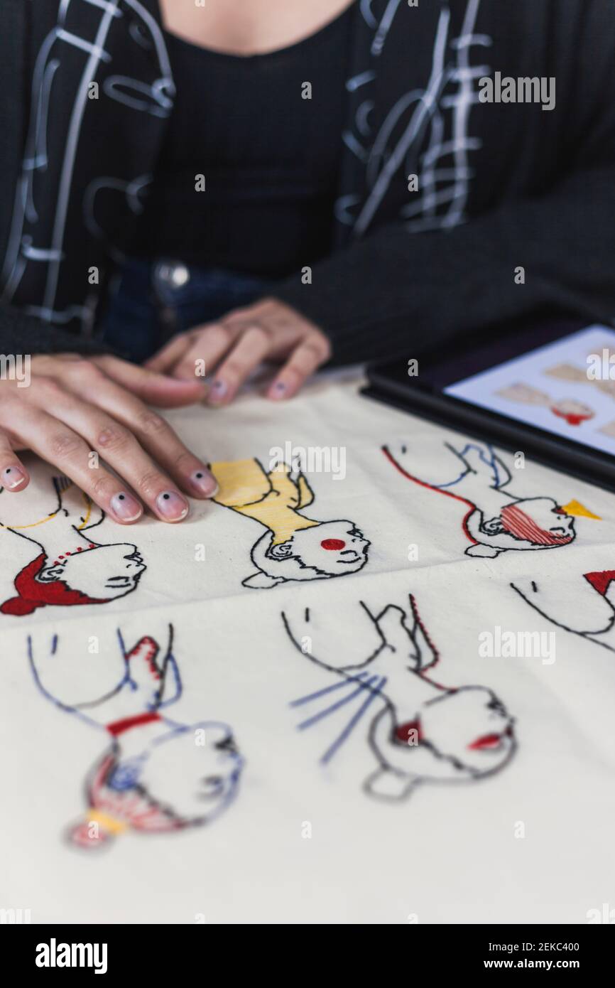 Female design professional with drawings at studio Stock Photo - Alamy