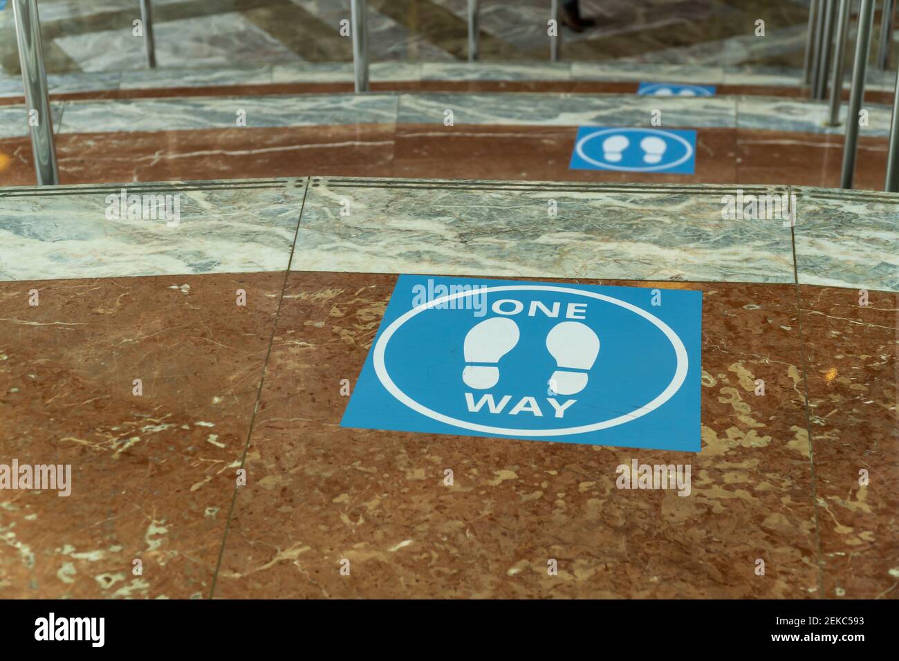 Wayfinding signage reminding people to observe social distancing ...