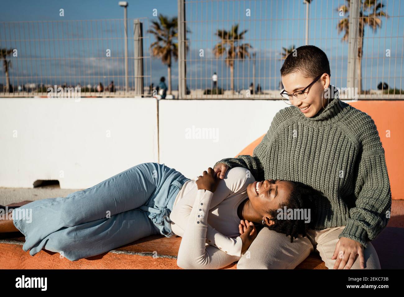Friends Sitting On Lap
