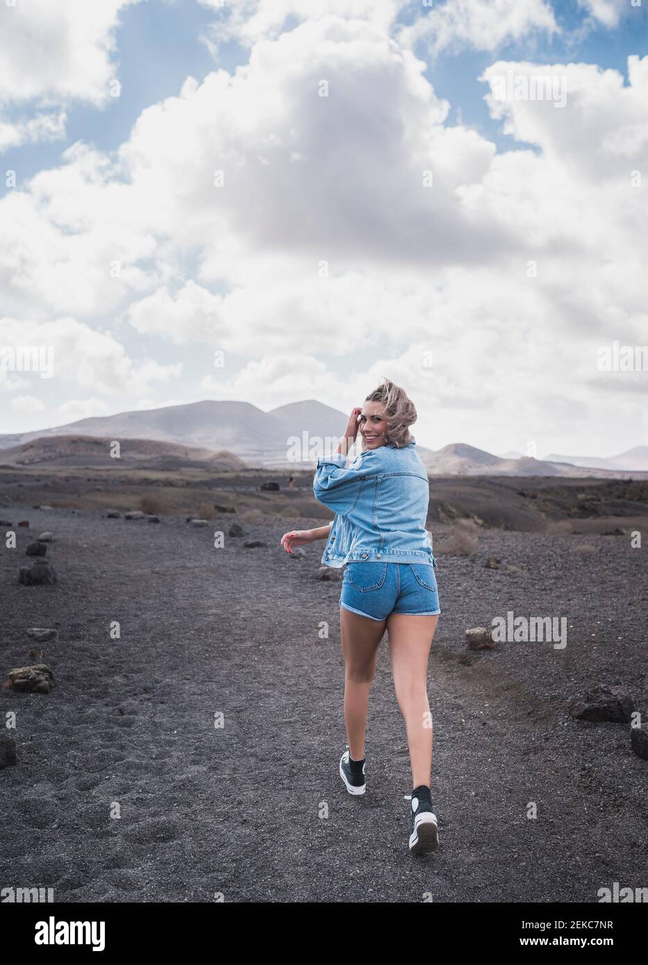 Young tourist smiling walking footpath volcano el cuervo hi-res stock ...