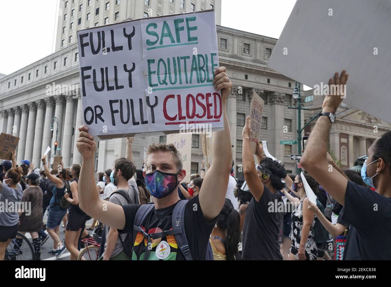 A protester holds a placard during the demonstration. Black Lives ...