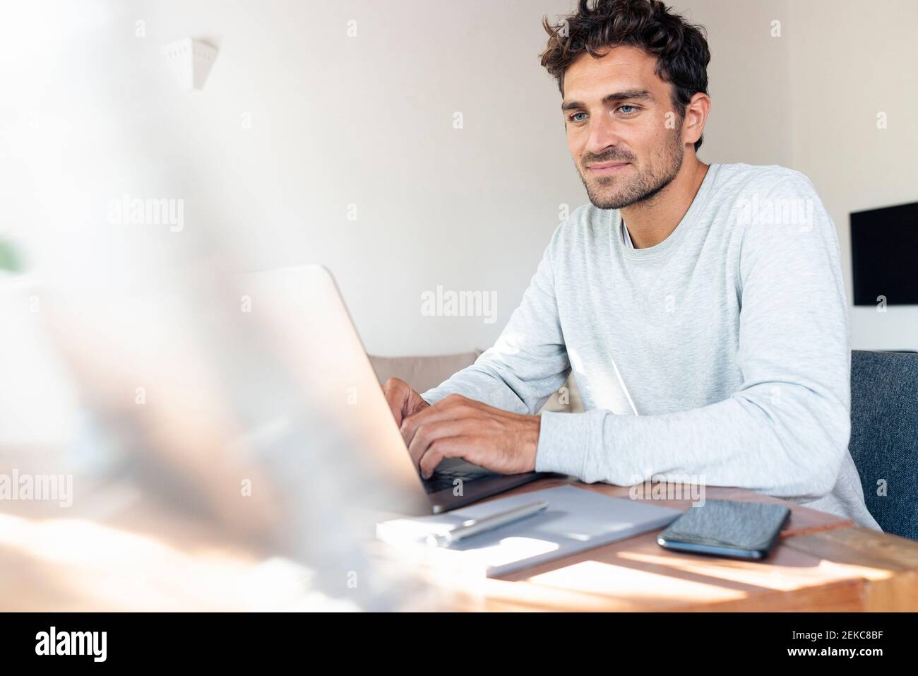 Man working laptop sitting table hi-res stock photography and images ...