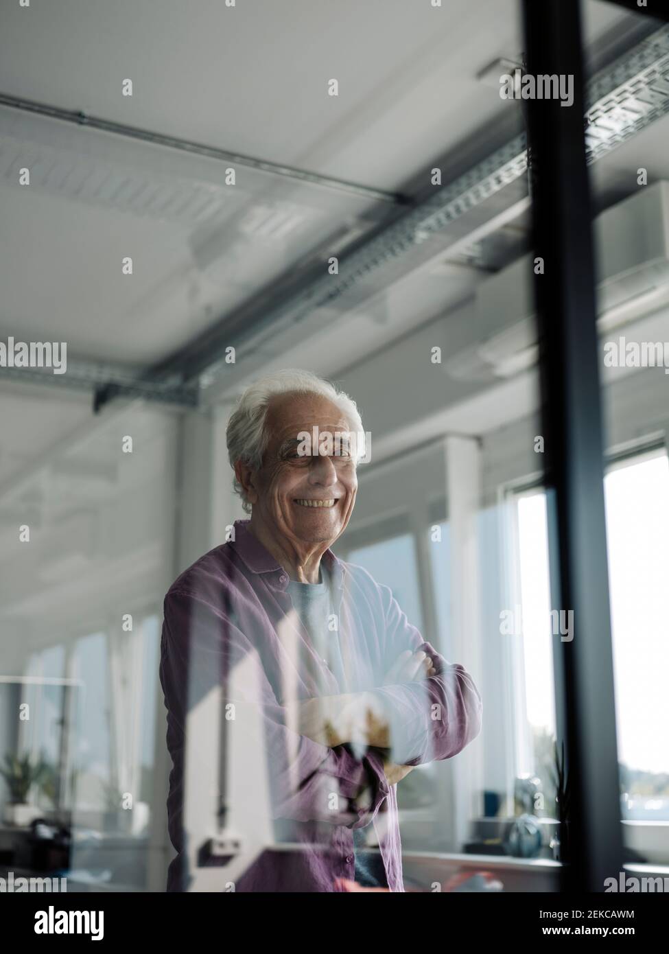 Businessman standing behind glass hi-res stock photography and images ...