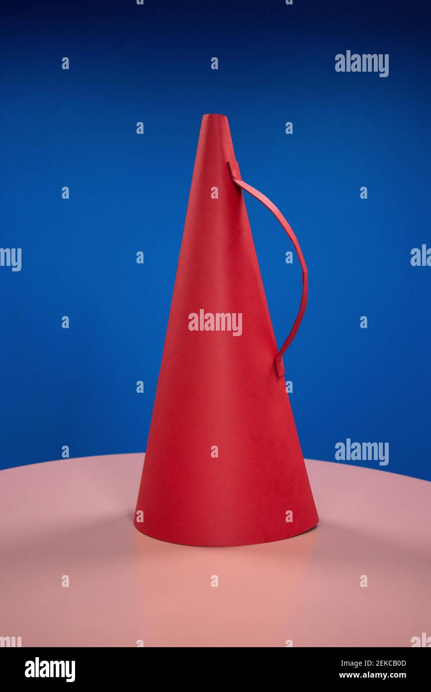 Red megaphone against blue background Stock Photo - Alamy