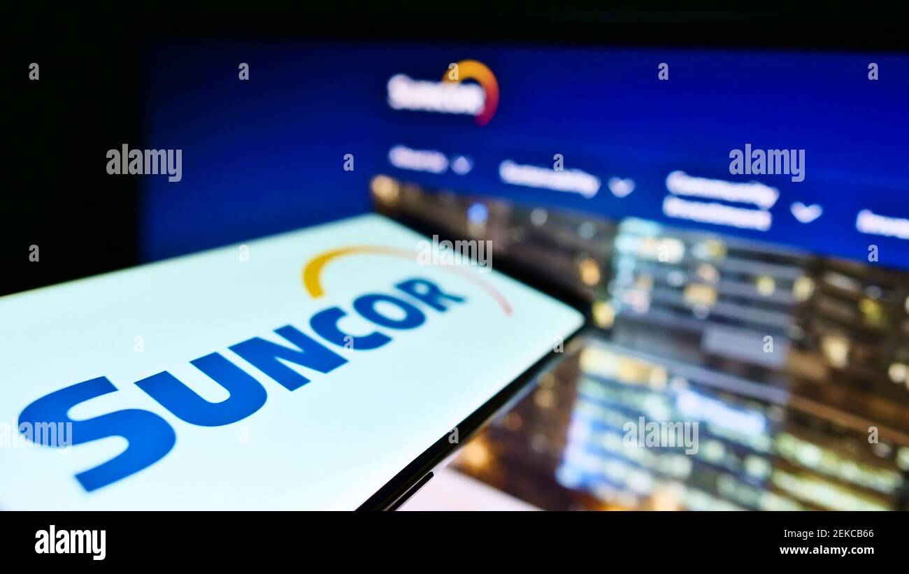 Smartphone with logo of Canadian oil and gas company Suncor Energy Inc ...