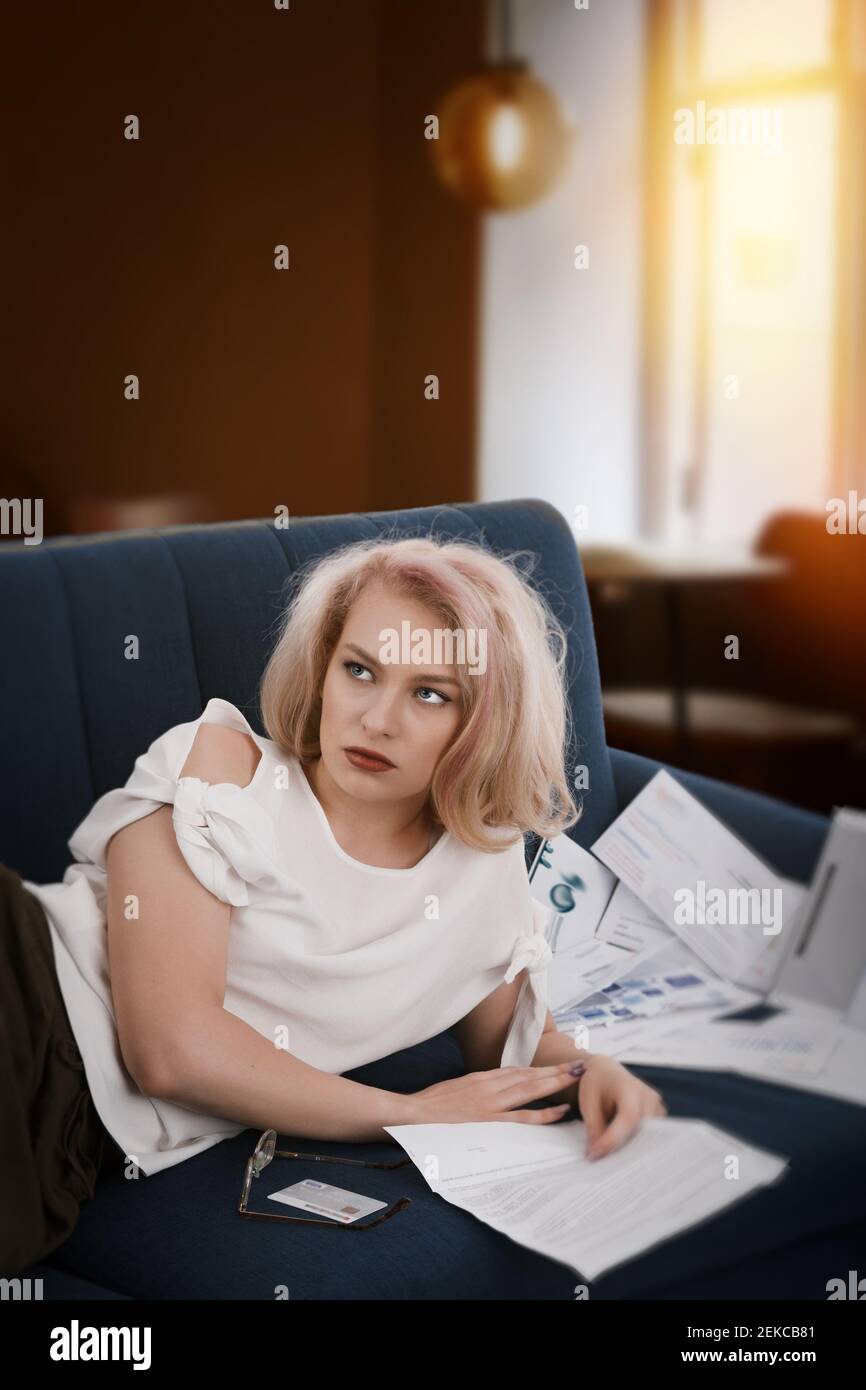 Stressed young woman looking angry, worrying about bank debt, looking ...