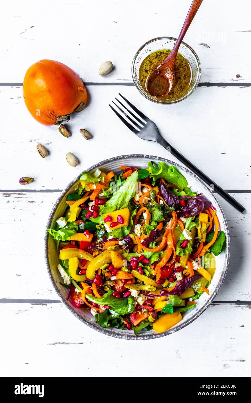 Mixed lettuce with bell pepper, feta, pistachios, tomatoes, pomegranate ...