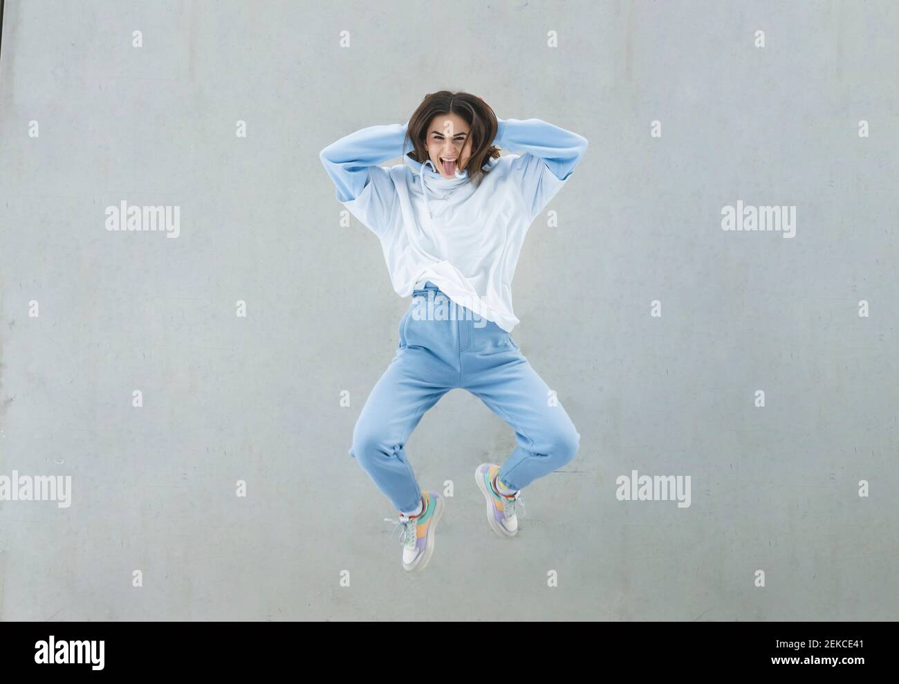 Young woman sticking tongue out open hi-res stock photography and ...
