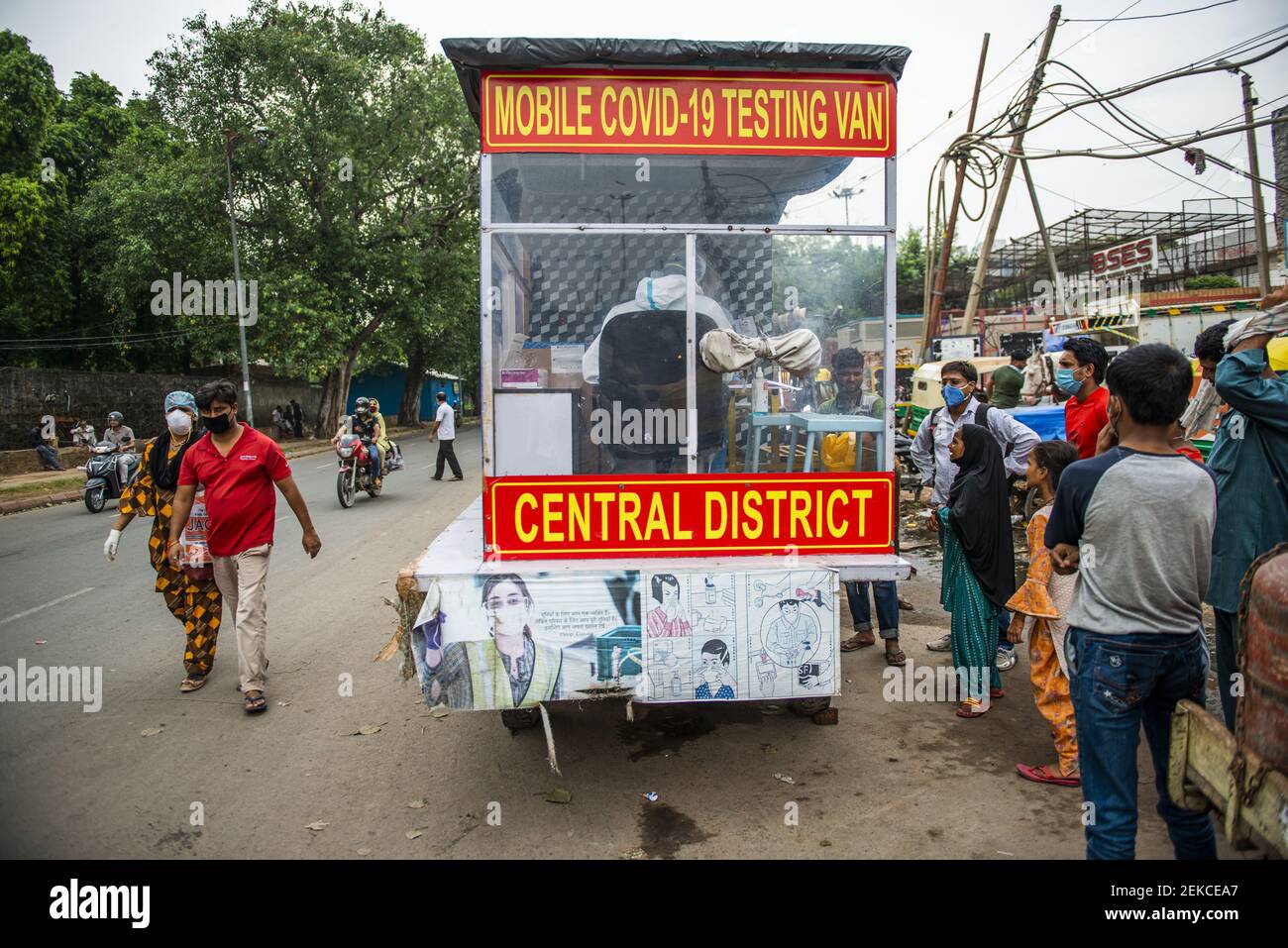 A covid19 mobile testing van is parked at a slum area during a free ...