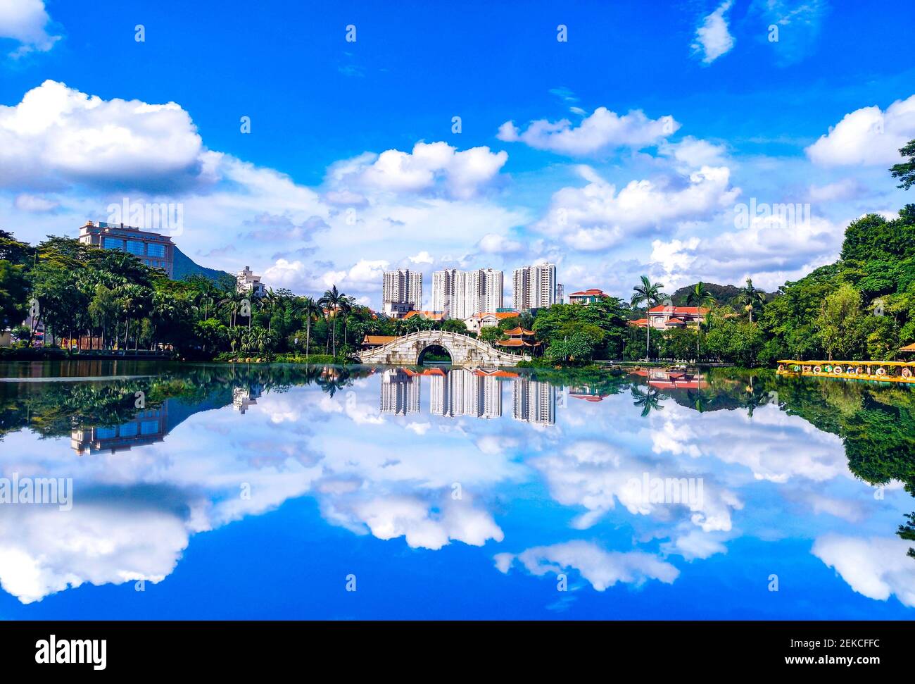 --FILE--Buildings seen from a local park and their reflections, Chang ...