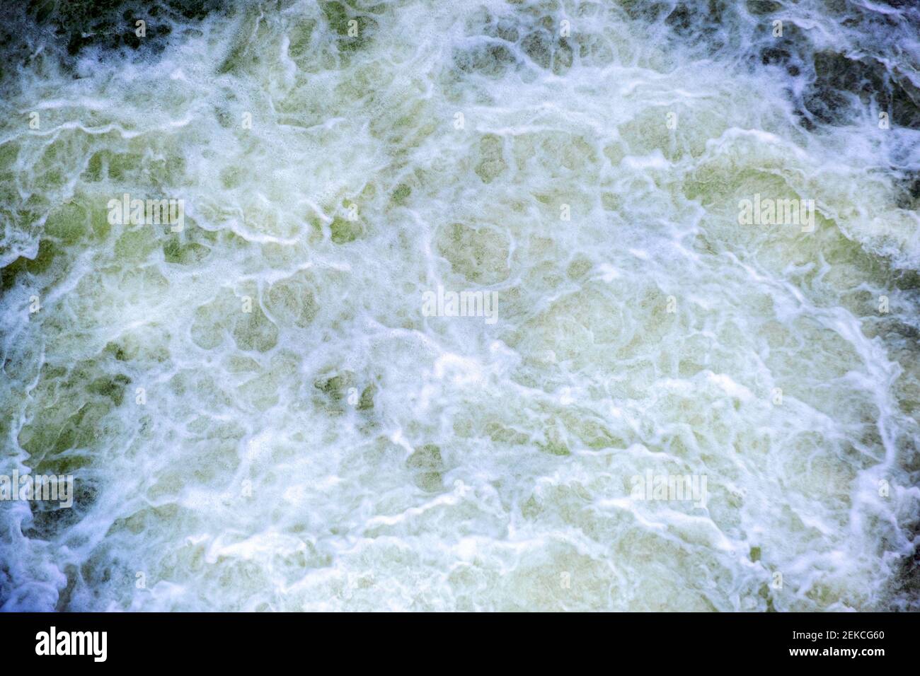 Aerial view of river waterfall with clear turquoise water falling down ...