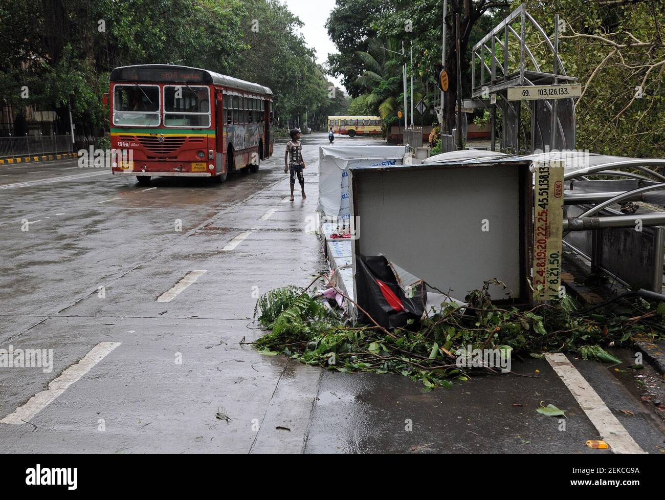 A bus stop shelter is seen broken and tipped over on the road in the ...