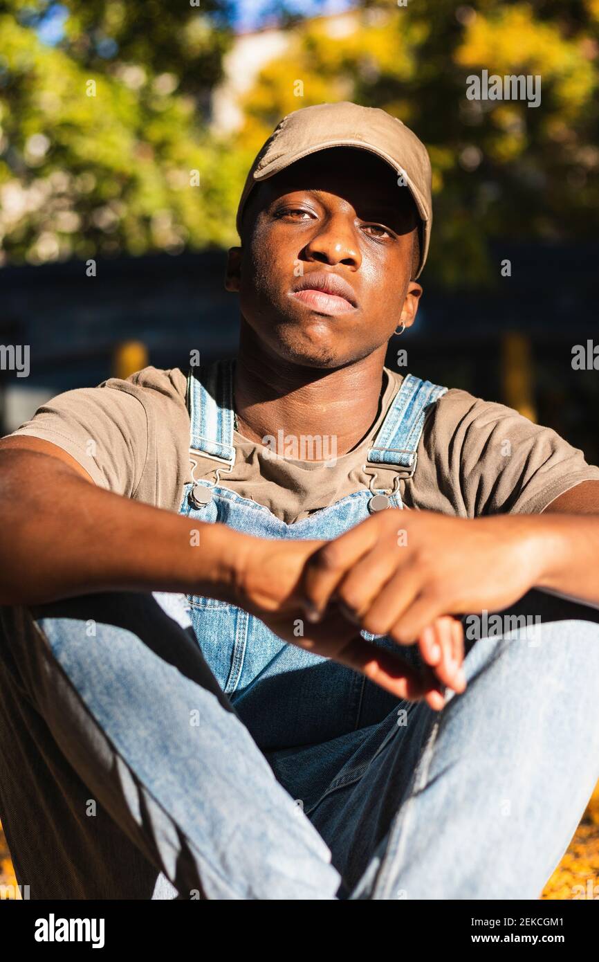 Man sitting on knees hi-res stock photography and images - Alamy