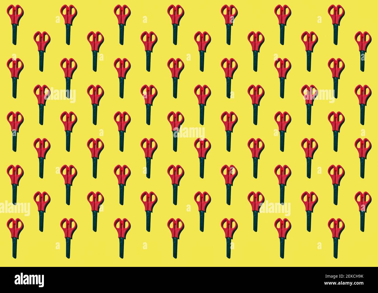 Pattern of rows of scissors against yellow background Stock Photo - Alamy