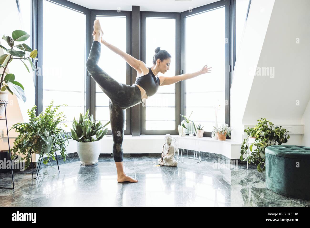 Woman practicing Dancer pose in living room at home Stock Photo - Alamy