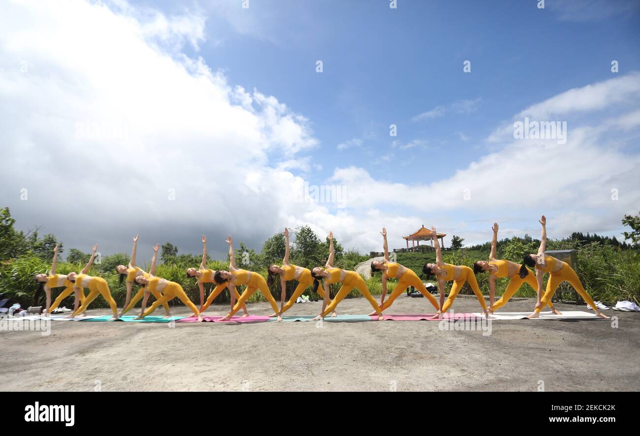 GUIYANG, CHINA - AUGUST 7, 2020 - Yoga devotees practice yoga in a ...