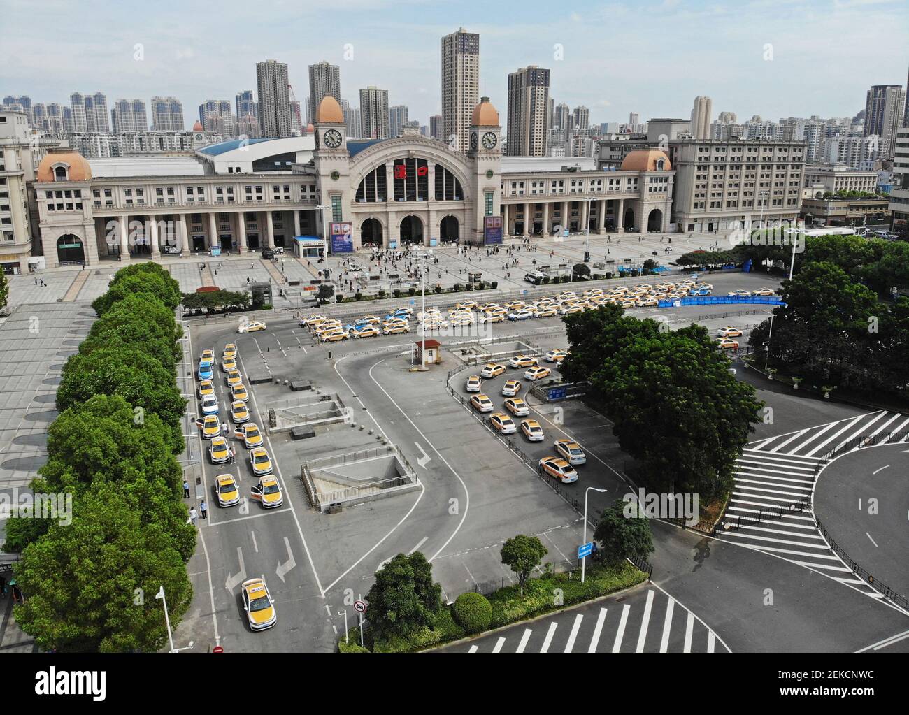 An aerial view of taxis queuing to pick up passengers from all around ...