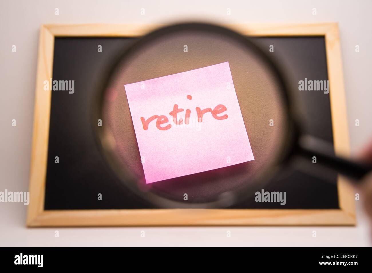 Retire word on blackboard Stock Photo - Alamy