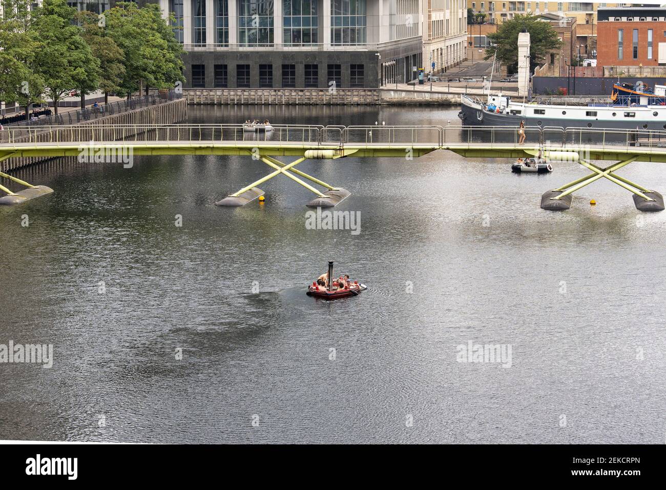 People enjoy the sun and the warm weather in a Skuna Hot Tub Boat on ...