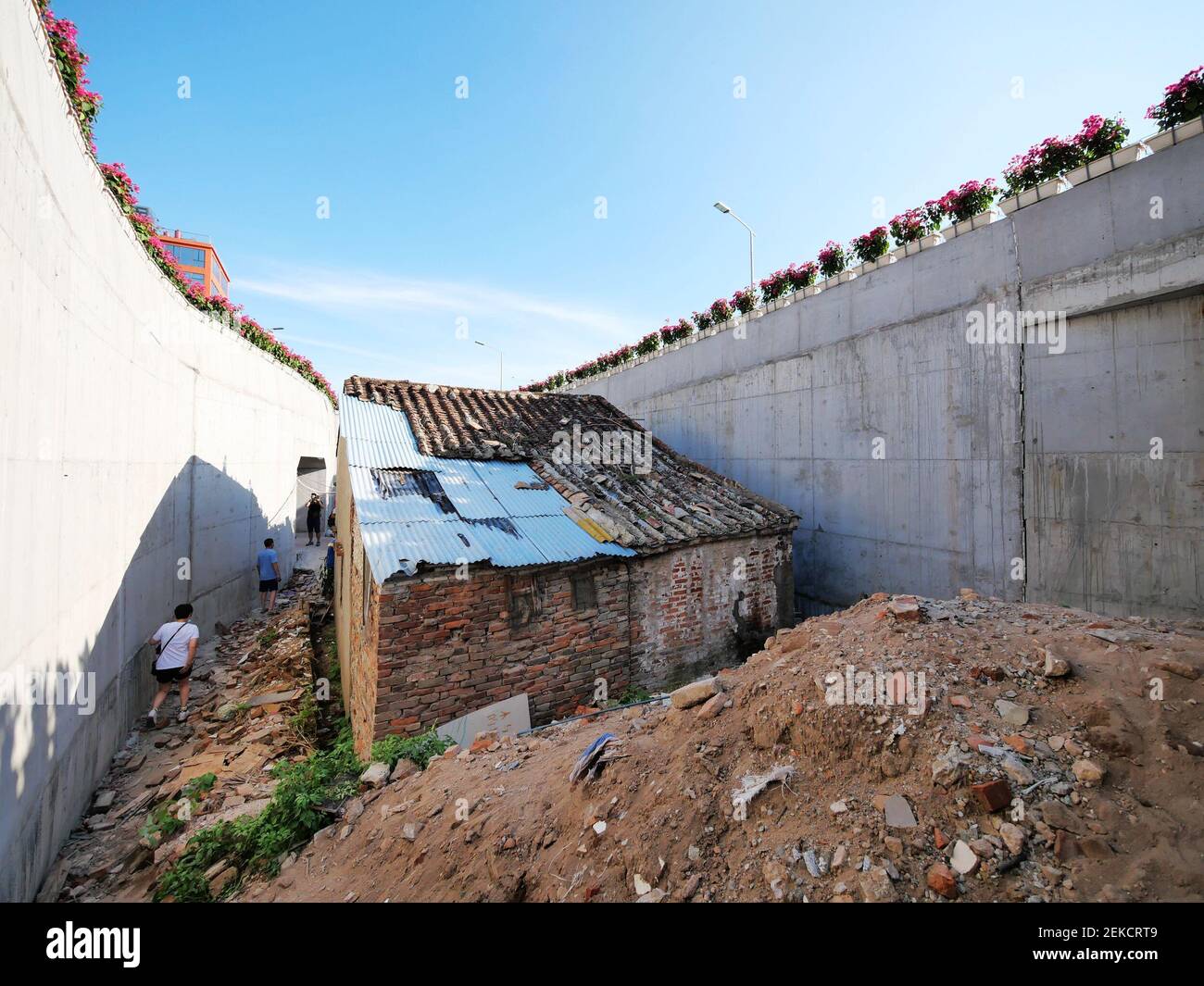 Local citizens and even tourists flock to see the house, which tightly ...