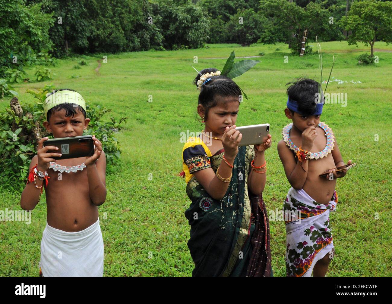 Indigenous children taking photos with their mobilephones during the ...