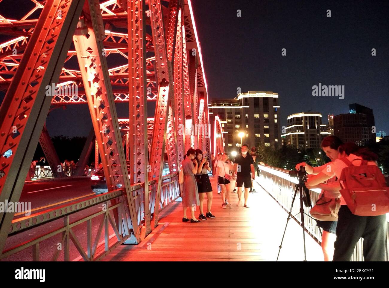 Tourists at the Bund gather around the Waibaidu Bridge, also known as ...