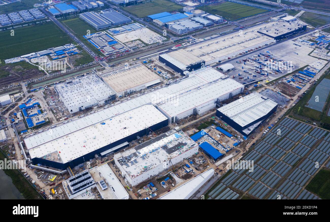 An aerial view of workers, with help of cranes and other construction ...