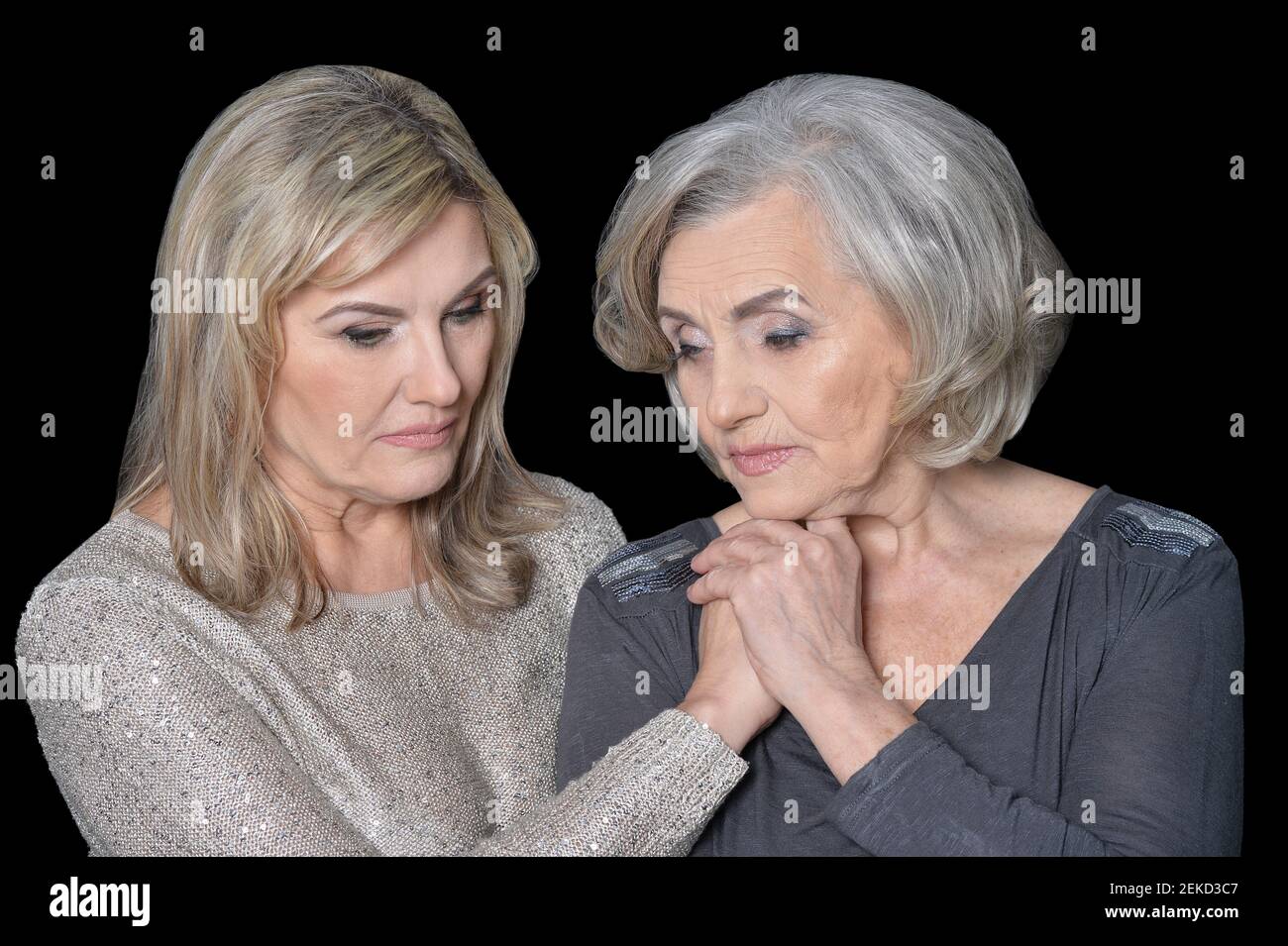 Portrait of a two sad women posing Stock Photo - Alamy