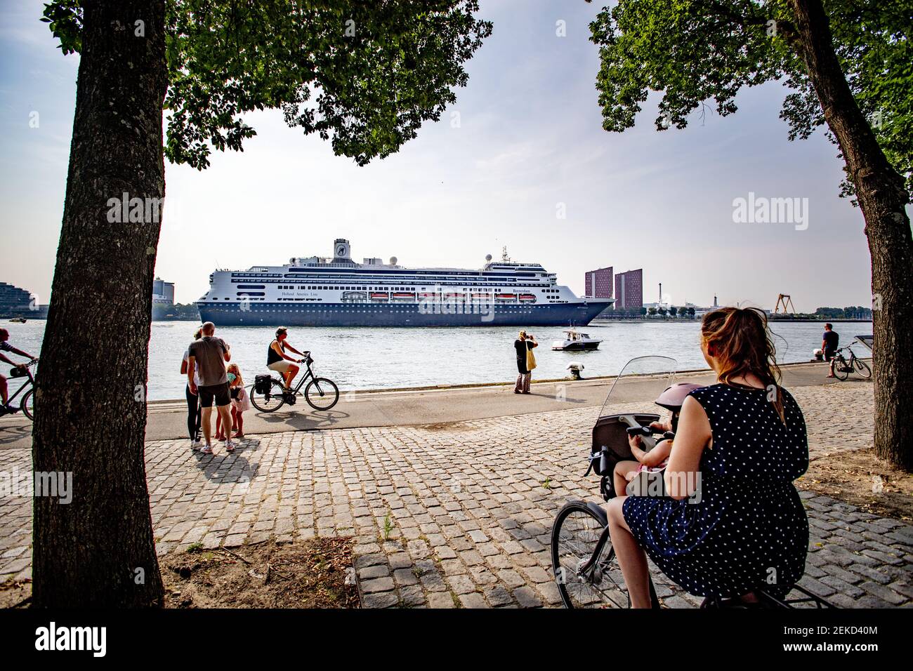 A woman watching the cruise ship. The MS Rotterdam, a Holland-America ...