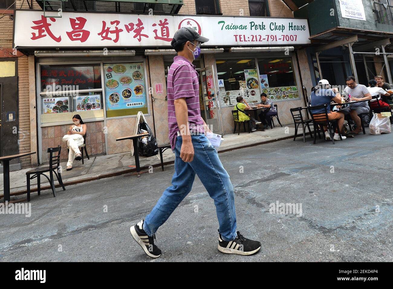 Patrons eat at tables set outside Taiwan Pork Chop House on Doyers ...
