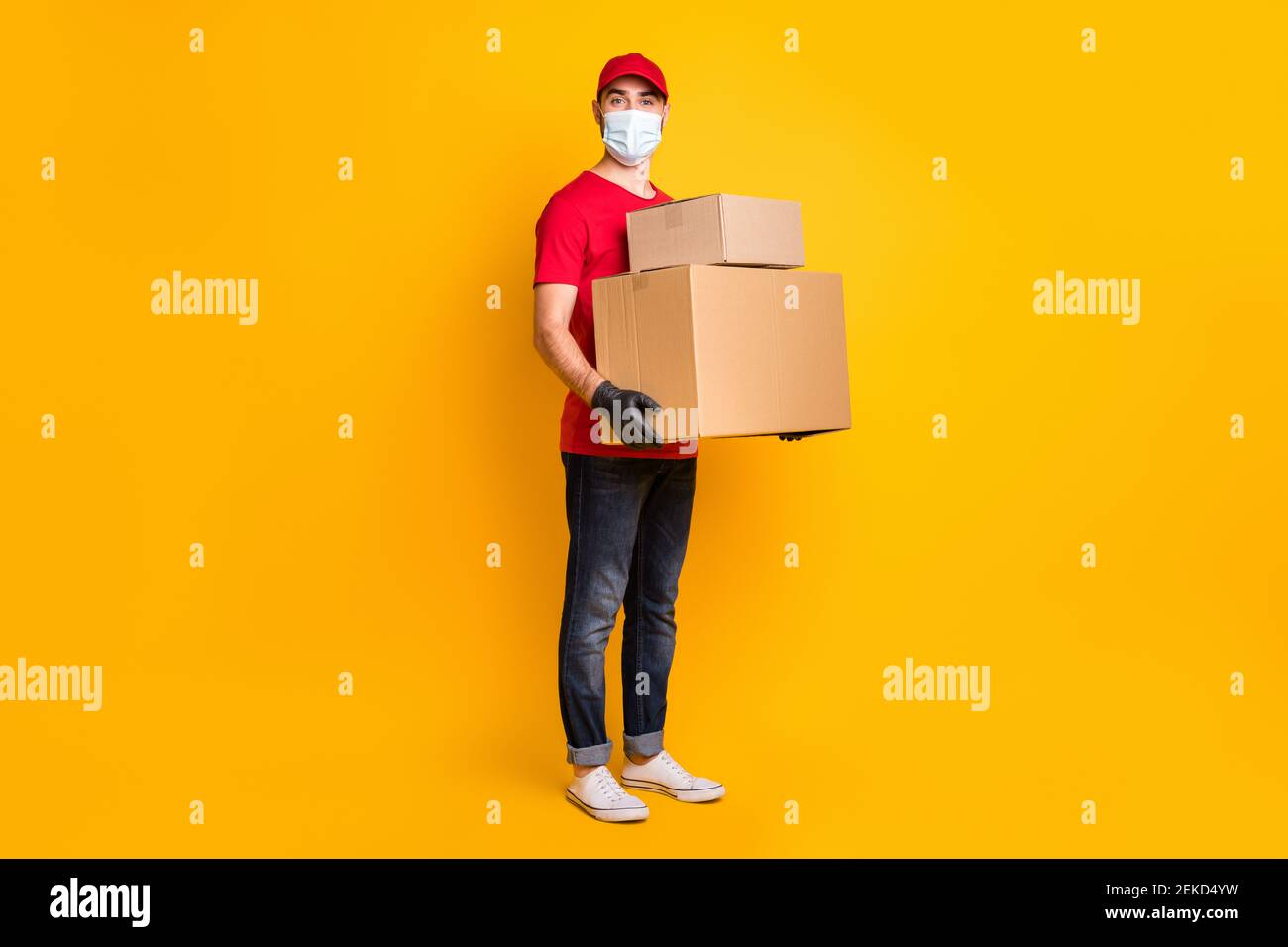 Full length body size view of nice guy mailman carrying big parcel wear ...